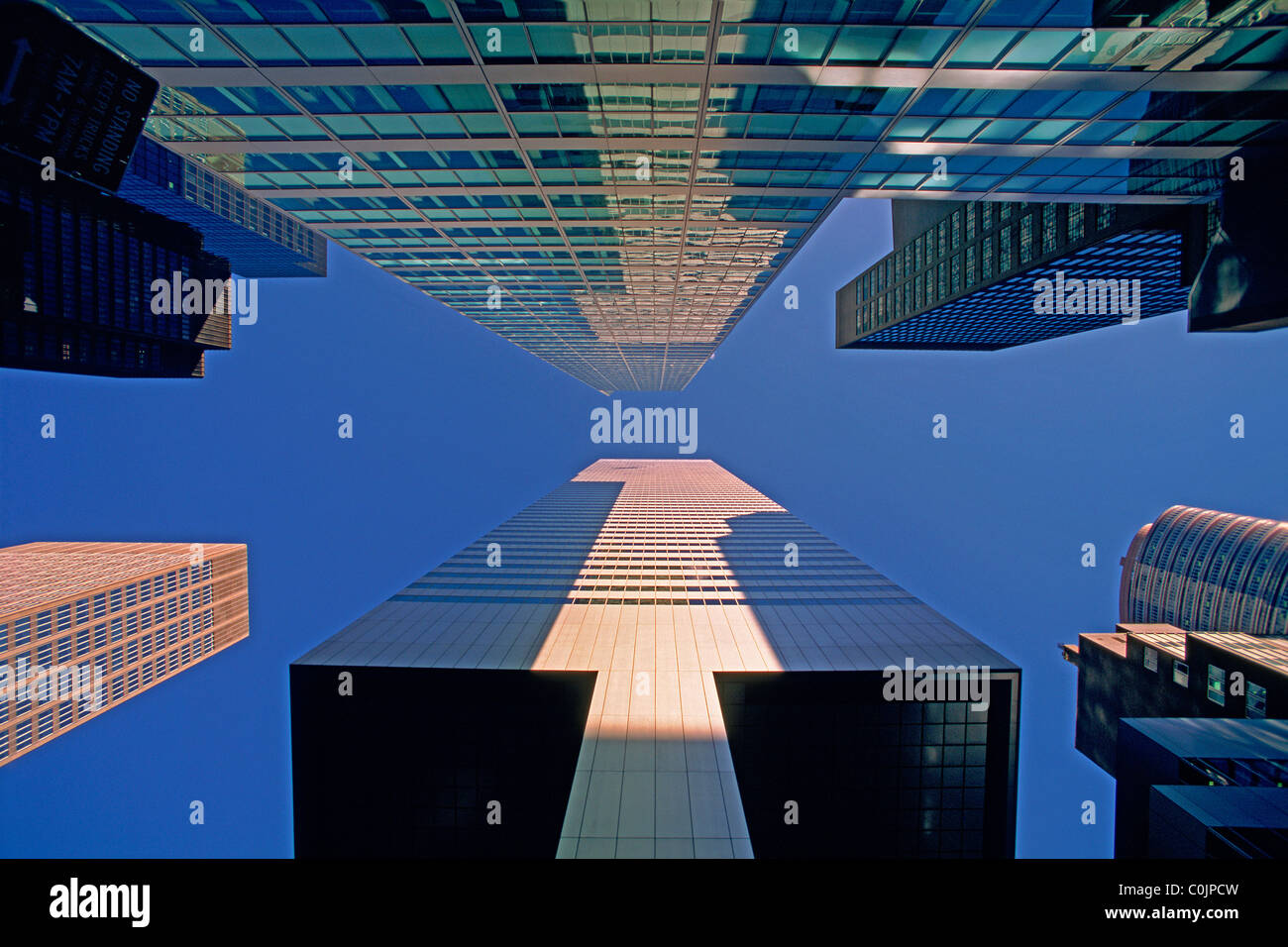 Looking up between office buildings in Midtown Manhattan, New York City ...