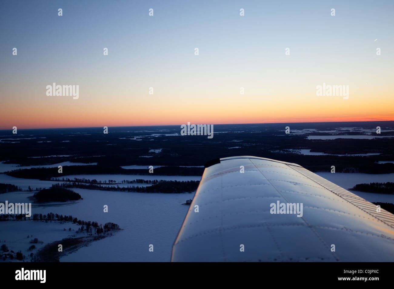 Sunrise from inside of a small aeroplane Stock Photo - Alamy