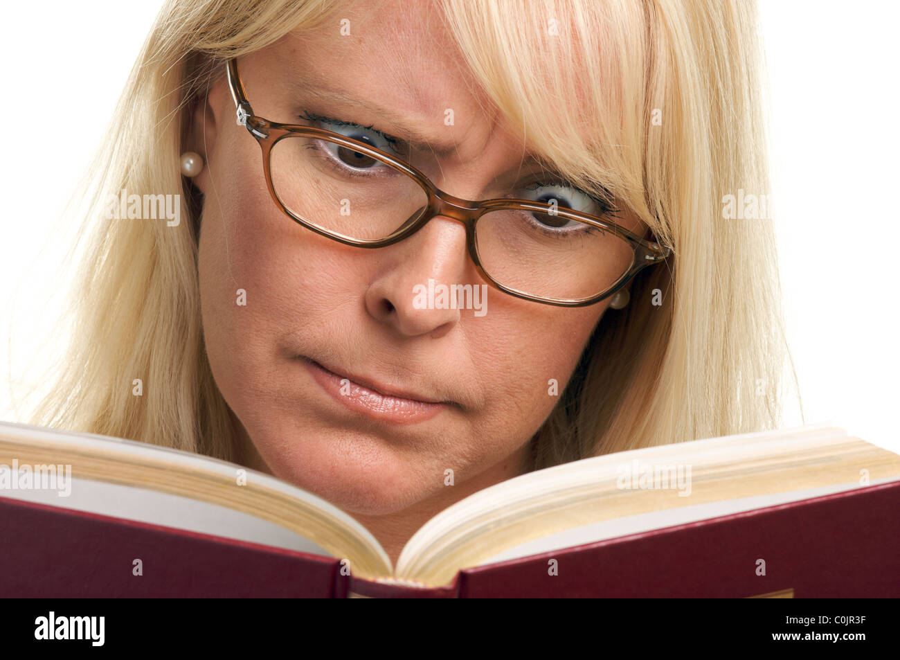 Perplexed Woman Reading isolated on a White Background Stock Photo - Alamy