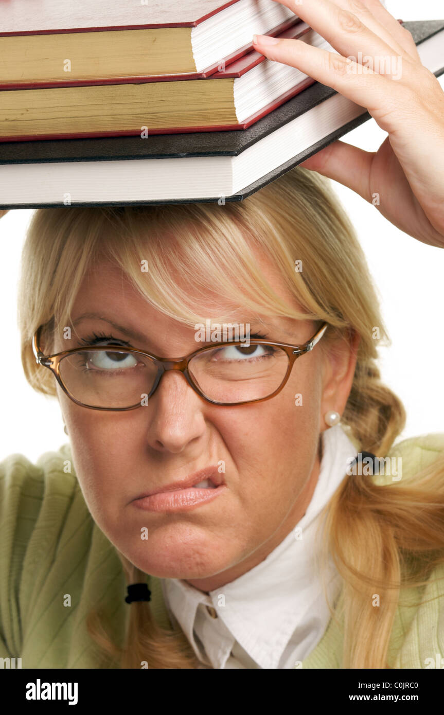 Disgruntled Student with Books Piled on her Head Isolated on a White ...