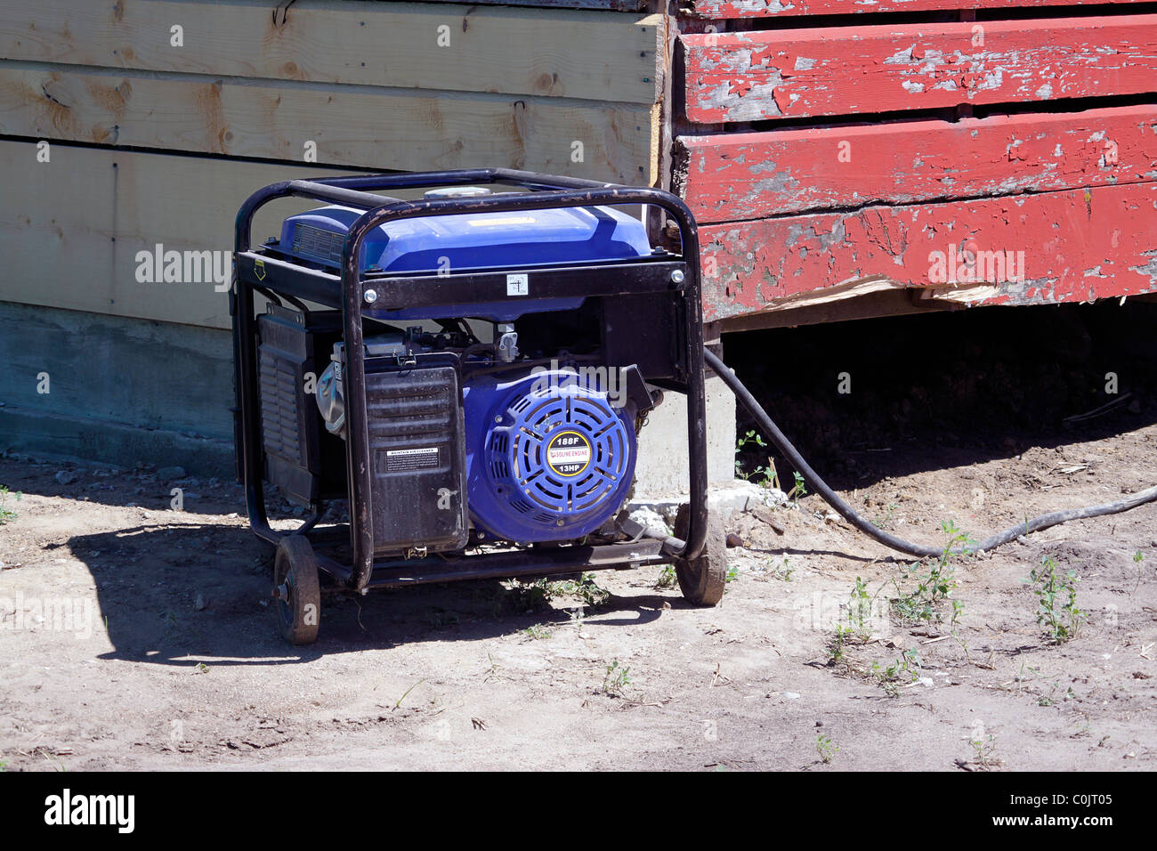 Portable generator being used at remote farm building Stock Photo - Alamy