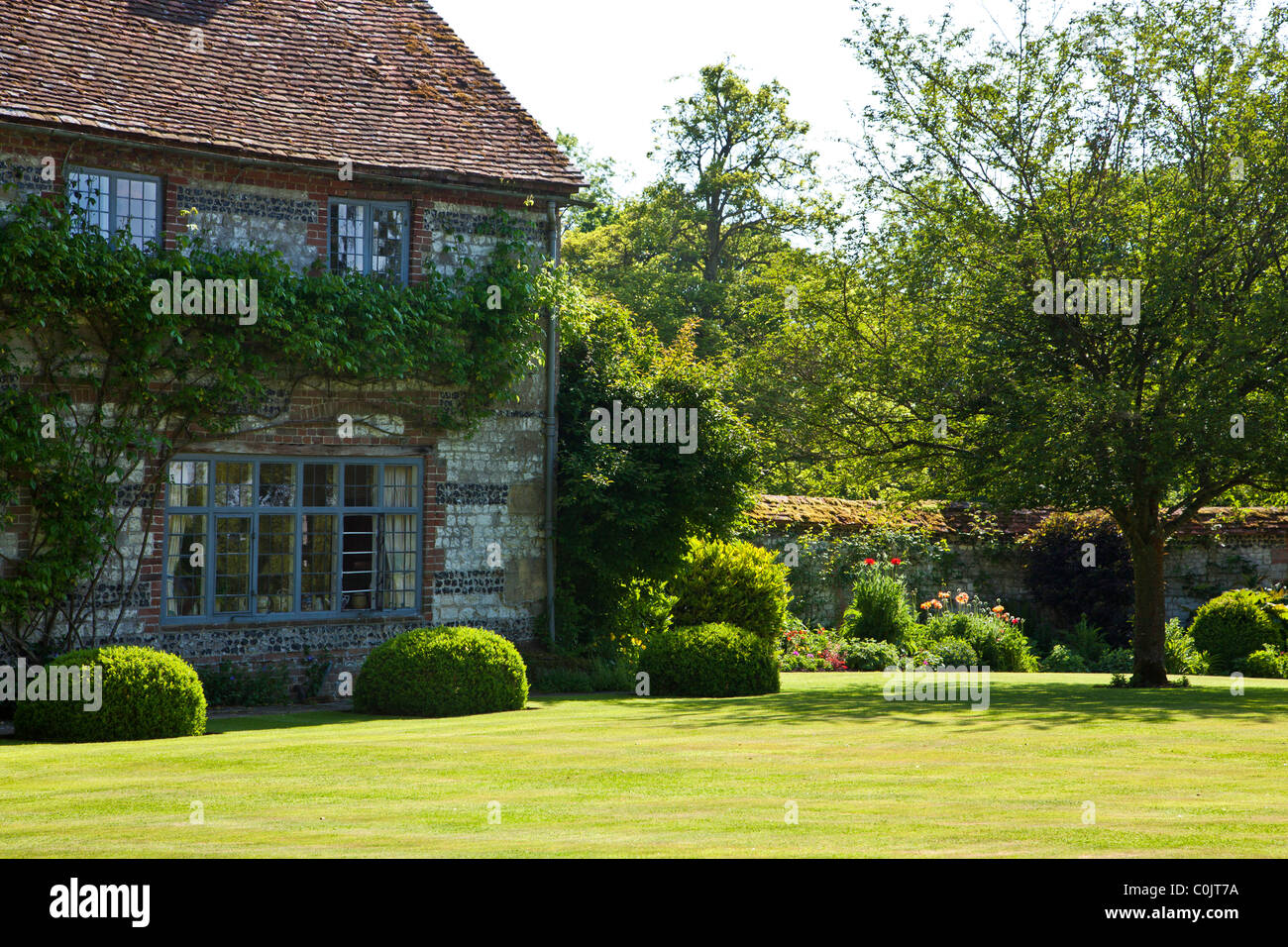 The walled garden and lawn of an English country house in Wiltshire ...