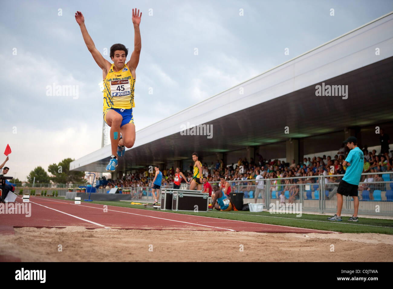 adult athlete man long jump Sport outdoor Athletics competition race ...