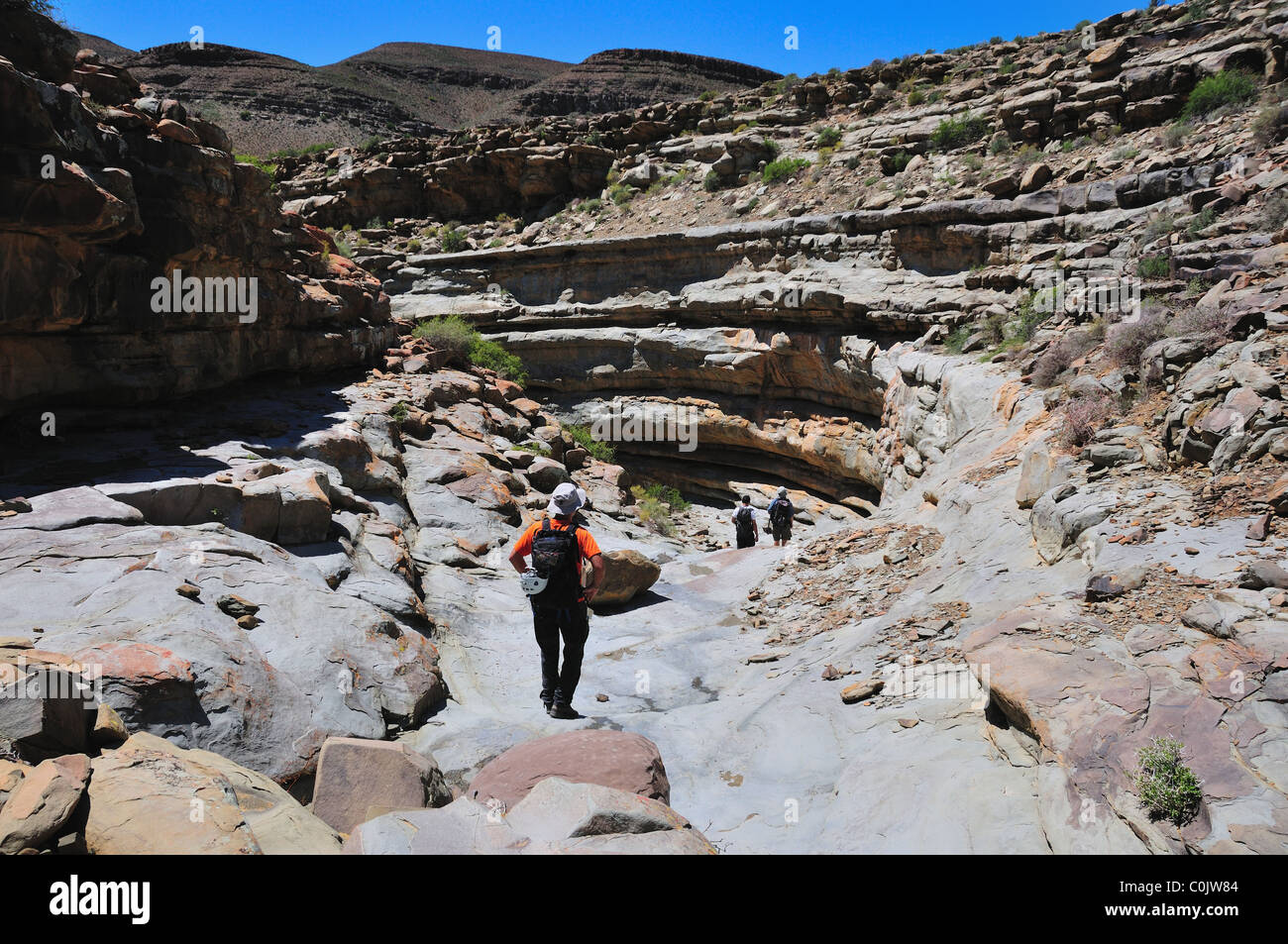 Hikers walk in a dry river bed. South Africa Stock Photo - Alamy