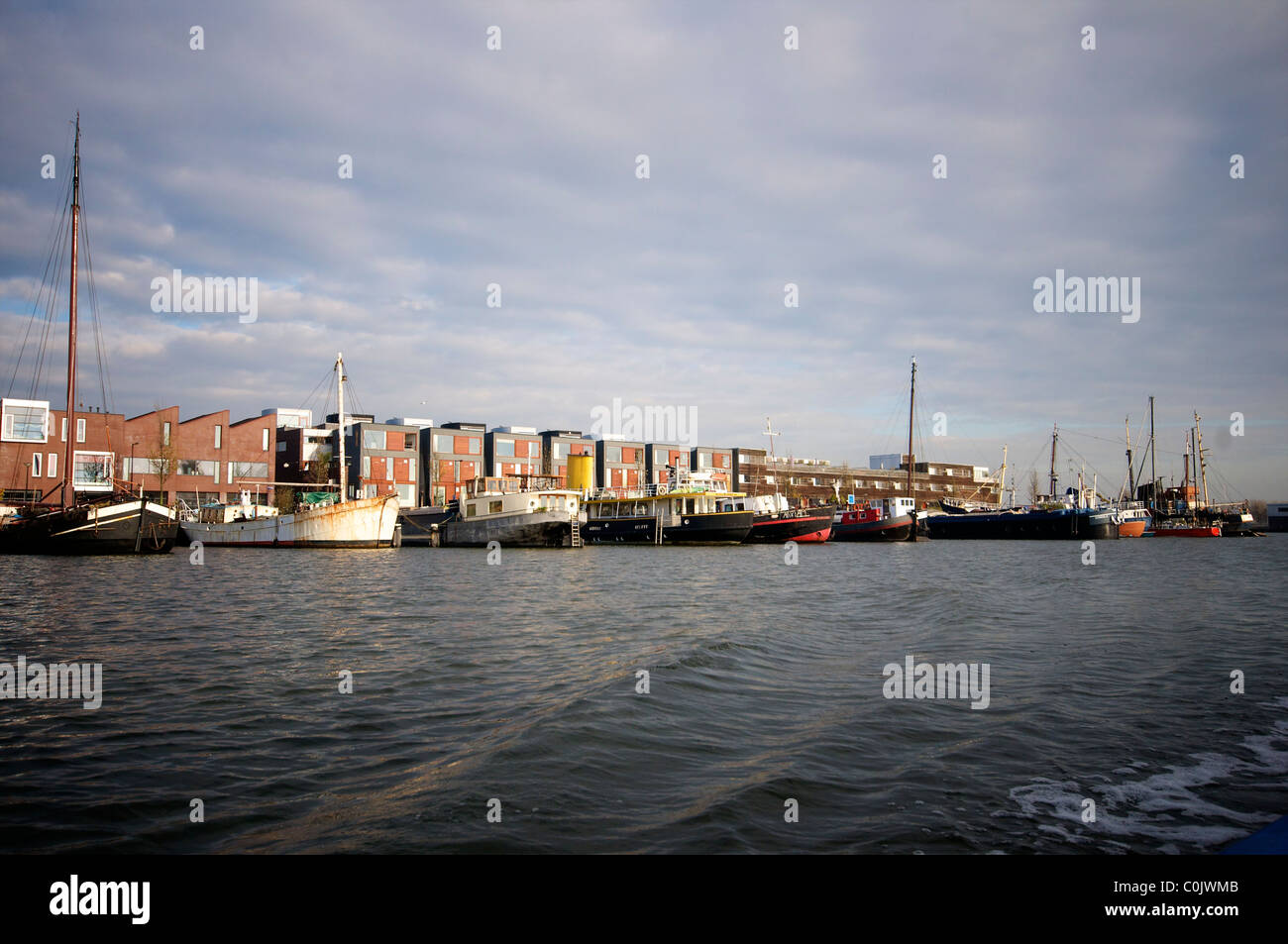 Buildings canal sea Amsterdam Stock Photo - Alamy