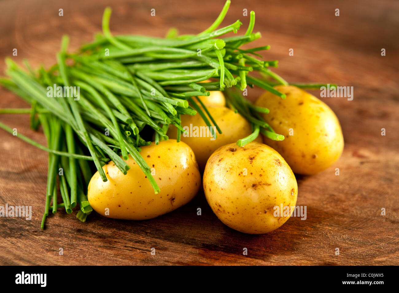 New potatoes and chives Stock Photo - Alamy