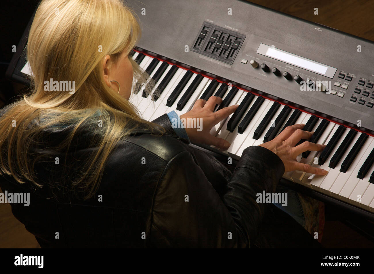 Hard Working Female Musician Sings While Playing Digital Piano Stock ...
