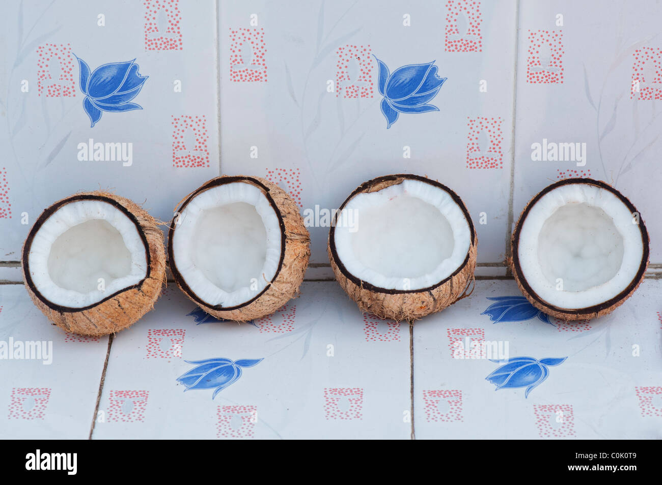 Four coconuts outside house in india. Puja , Hindu ritual. Offerings to ...