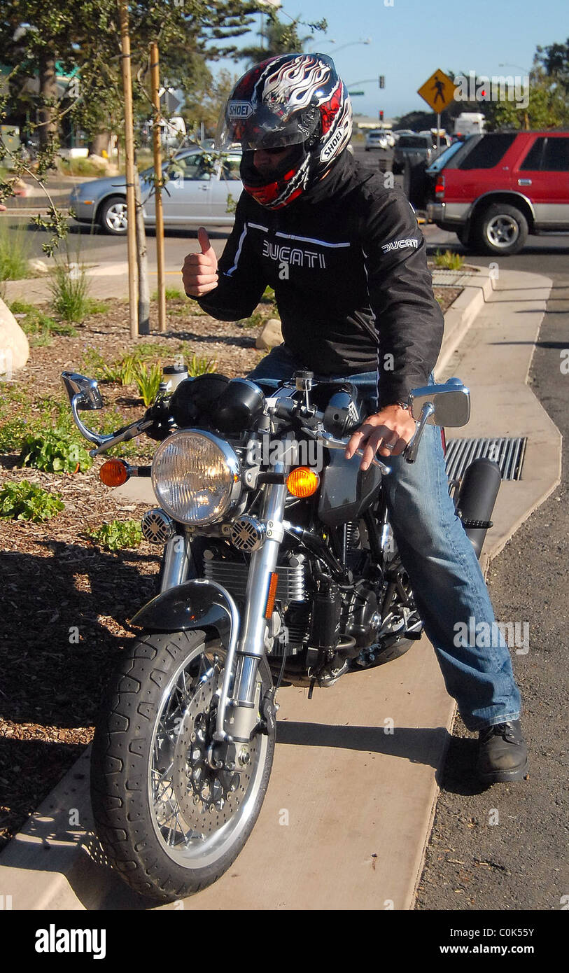 Dean McDermott gets ready to leave on his motorcycle after spending the ...