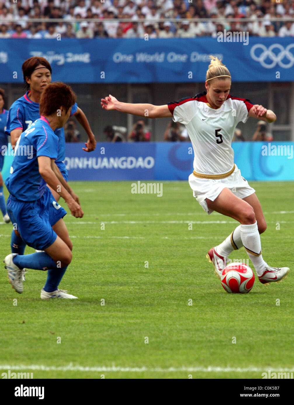 Players fight for the ball during the Olympic Women's Soccer Match ...