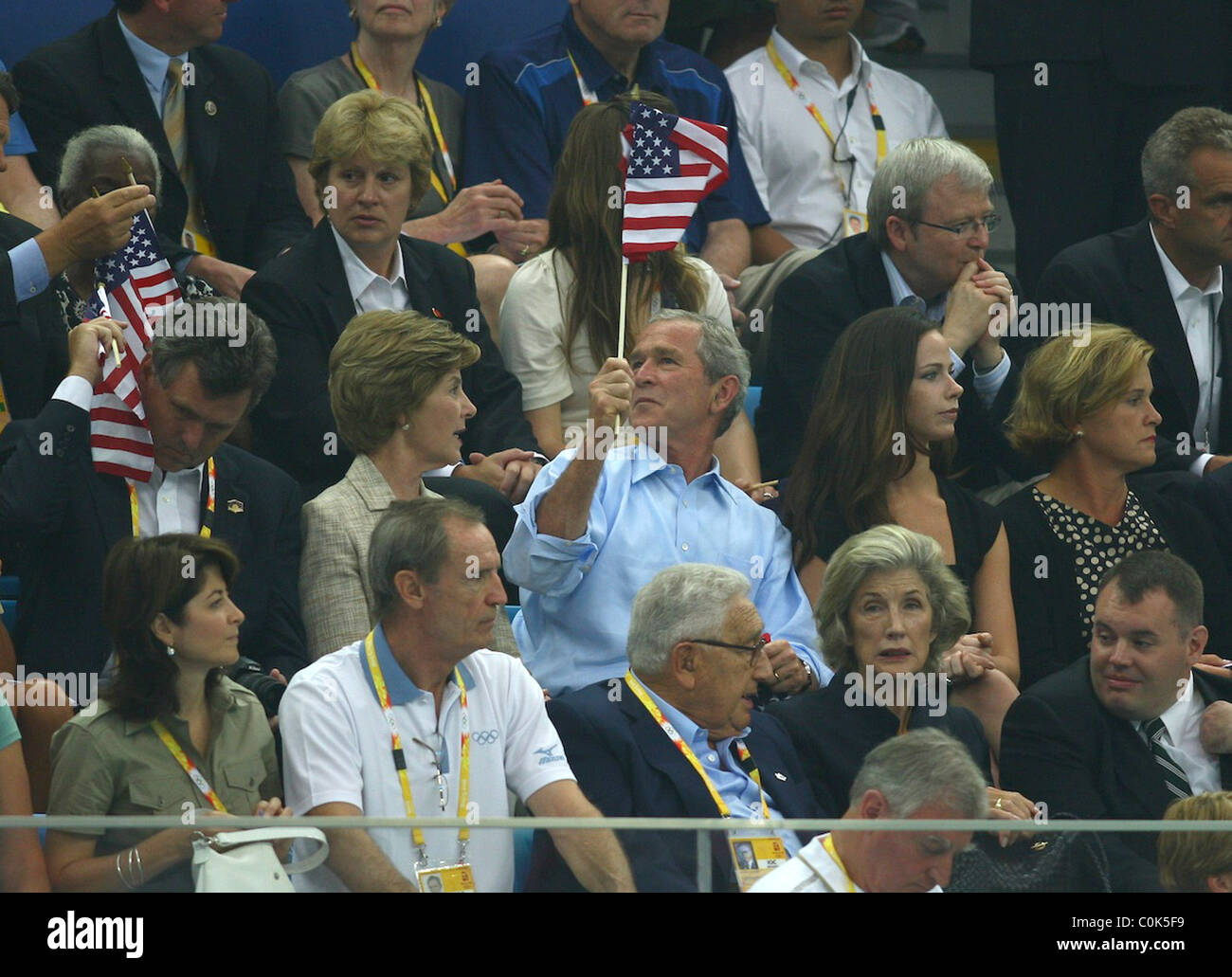Laura Bush, President George Bush and Barbara Bush watches the swimming ...