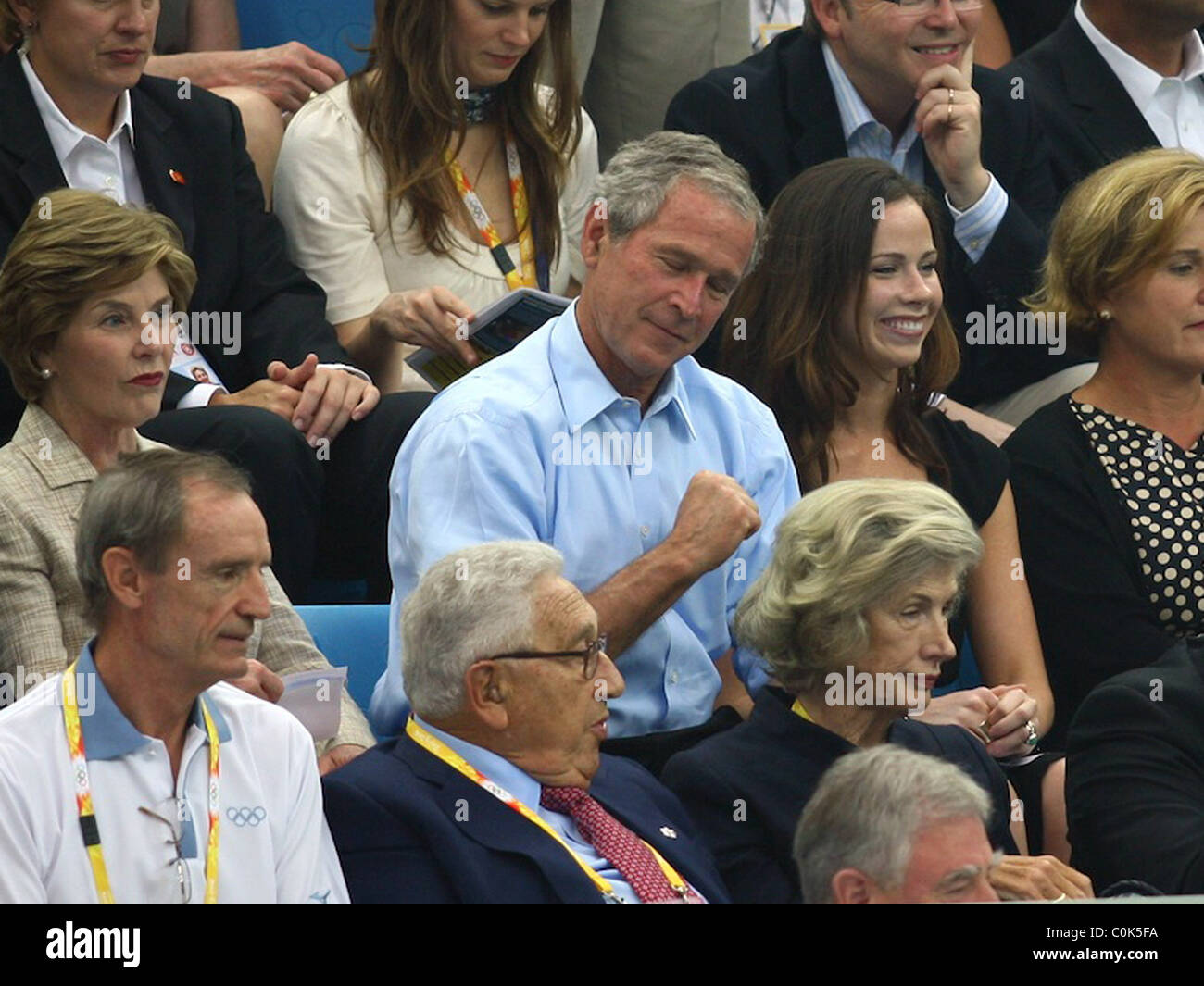 Laura Bush, President George Bush and Barbara Bush watches the swimming ...