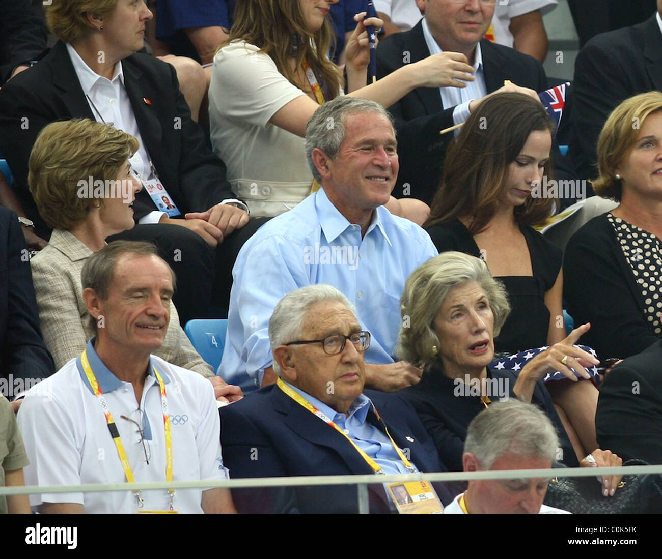 Laura Bush, President George Bush and Barbara Bush watches the swimming ...