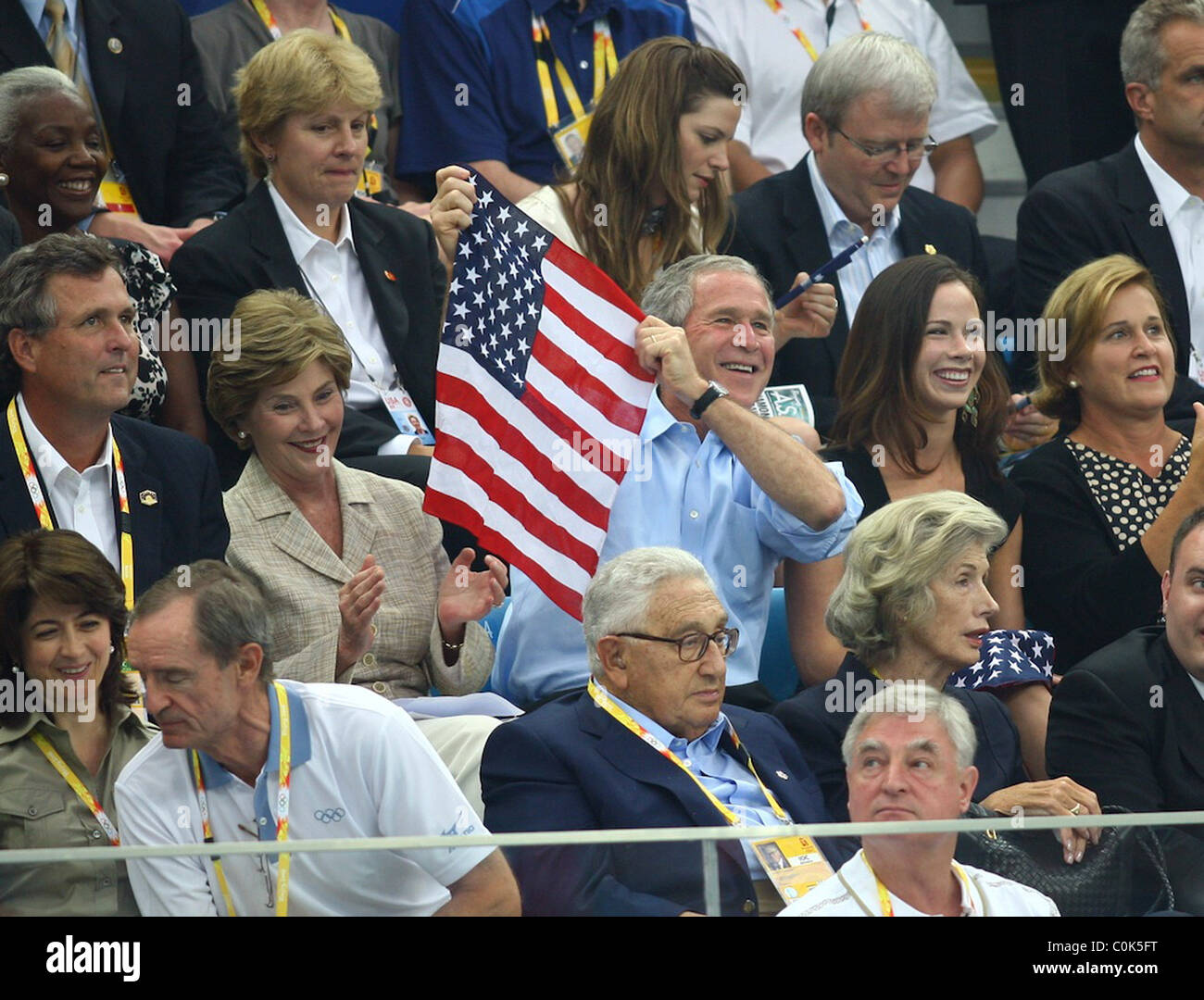 Laura Bush, President George Bush and Barbara Bush watches the swimming ...