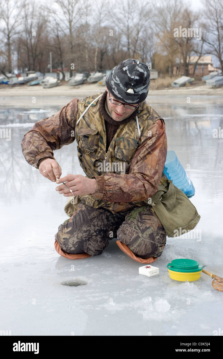 ice fishing competition. competitor catches the fish on Ice Fishing Jig ...