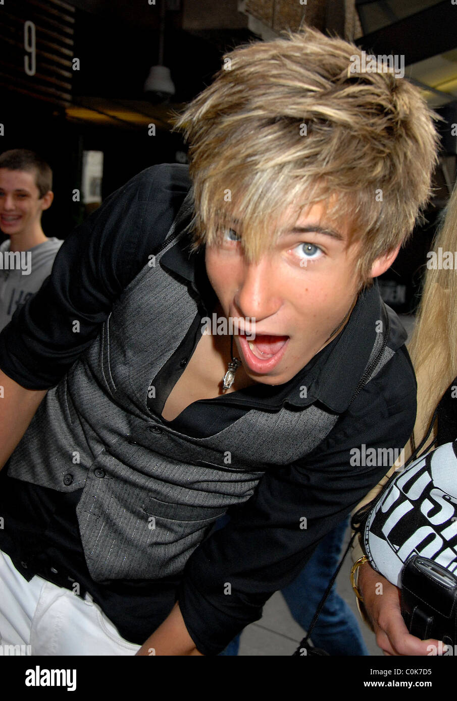 CJ Baran from Push Play stops to pose for fans as he arrives at the ...