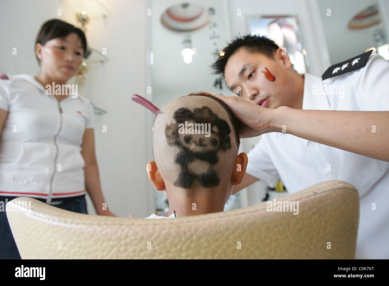 OLYMPIC FANS HAVE STYLE Hair we go... A barber in Zhengzhou, China is ...