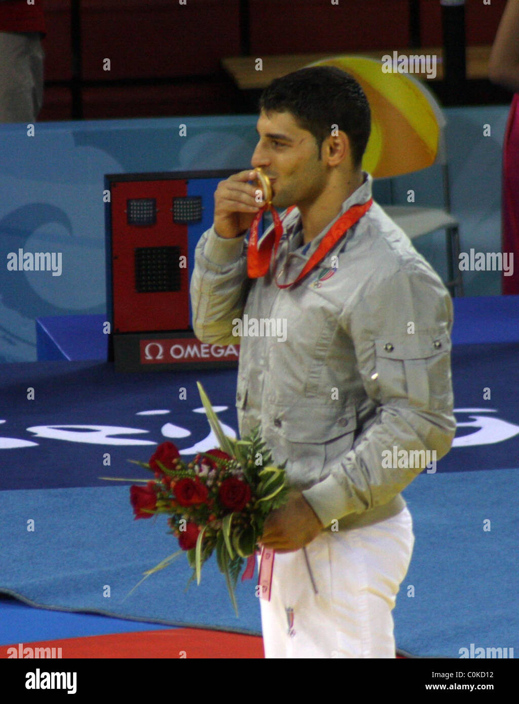 Italy's Andrea Minguzzi celebrates winning a gold medal after defeating ...