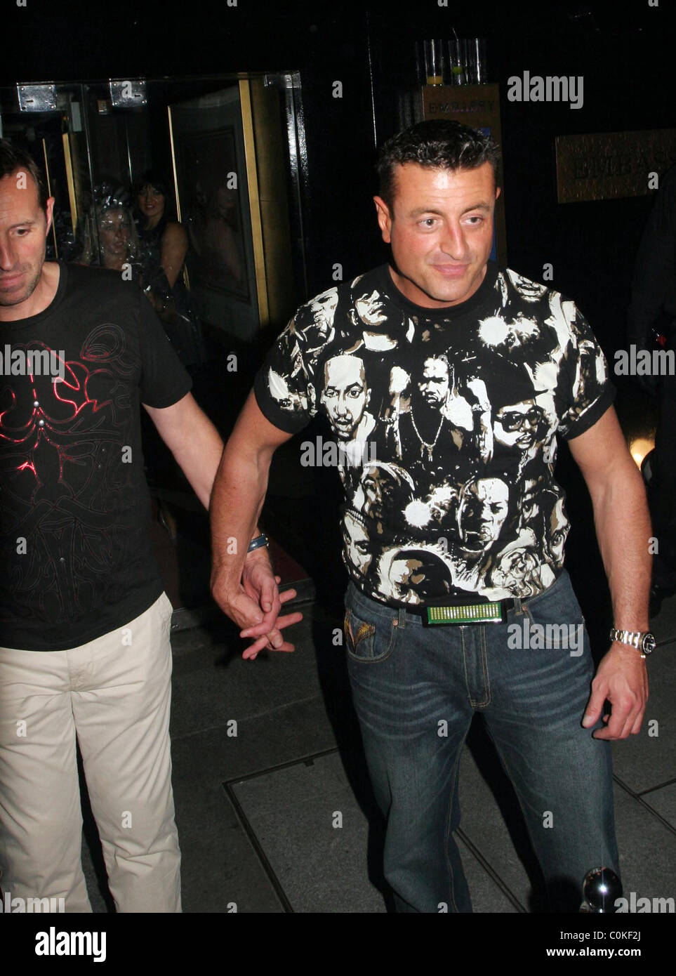 Mario Marconi and a mystery man leaving Embassy nightclub London ...