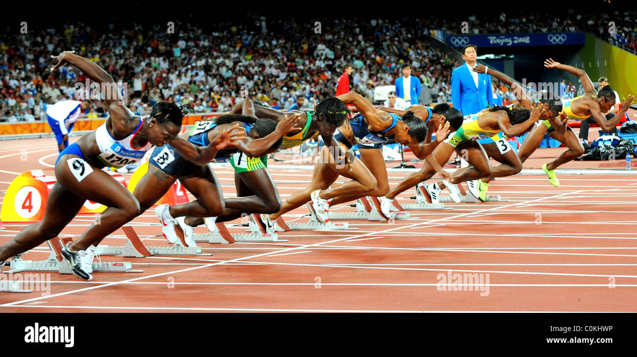 Runners leave the starting blocks during the women's 100m final at the ...