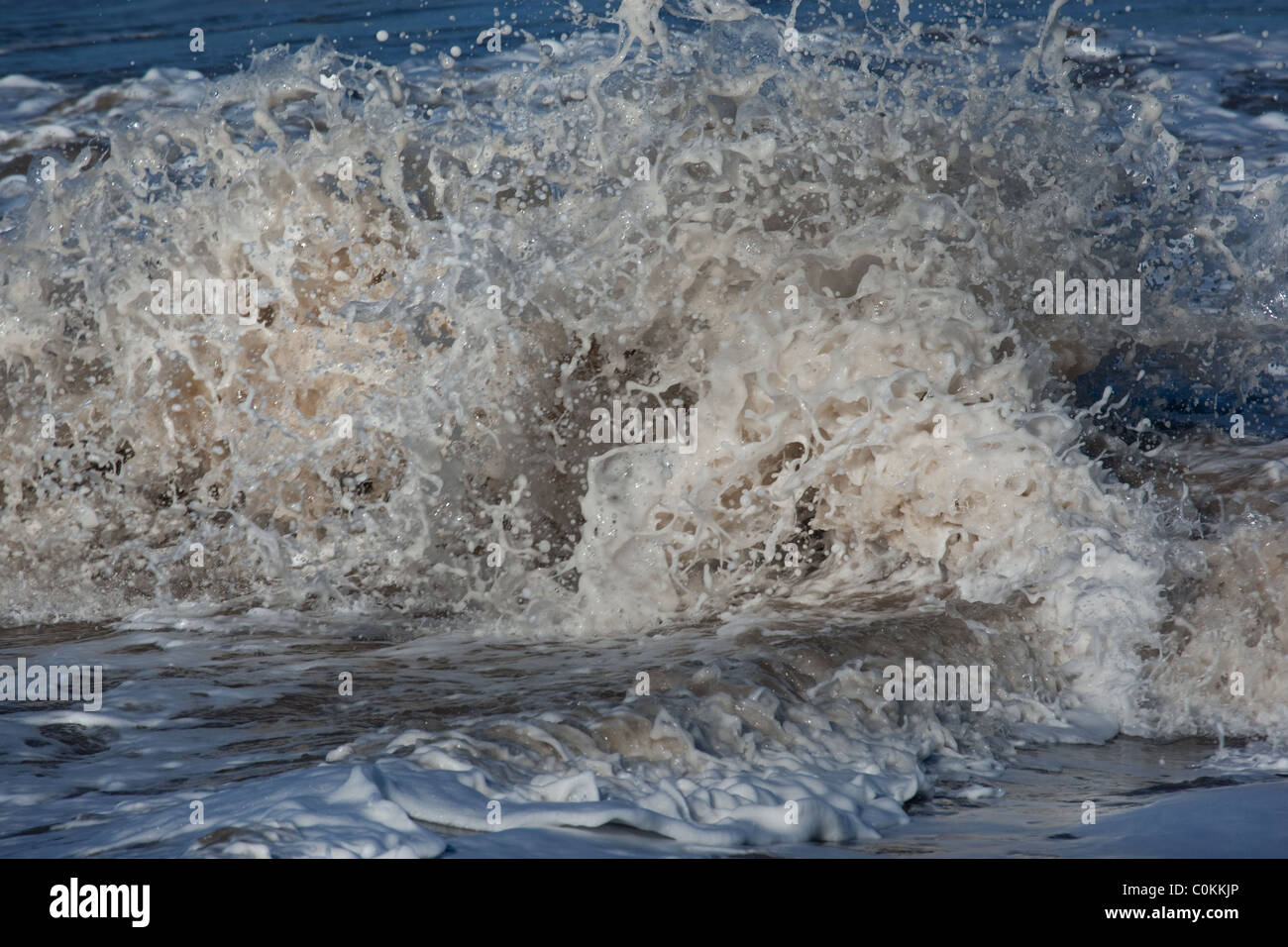 Waves on the shoreline Stock Photo - Alamy