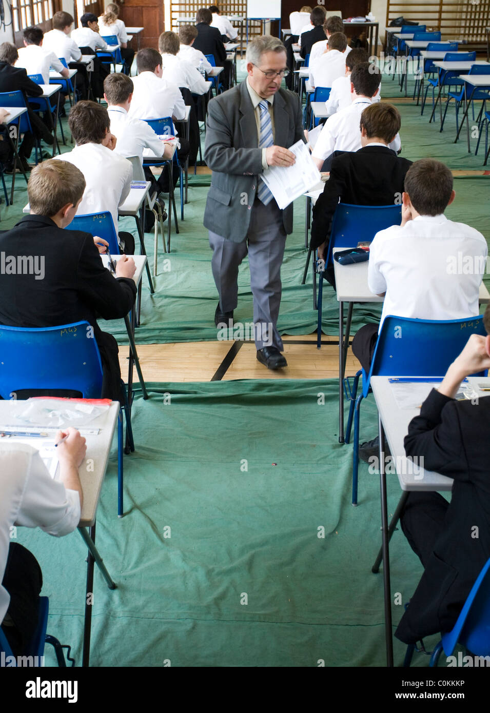 Pupils fill an exam hall to take a GCSE exam at Maidstone Grammar ...