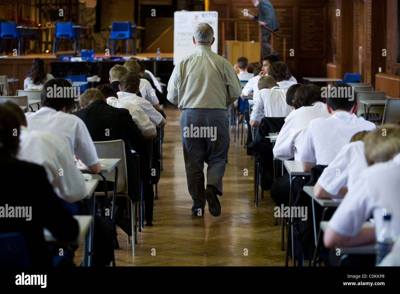 Pupils fill an exam hall to take a GCSE exam at Maidstone Grammar ...