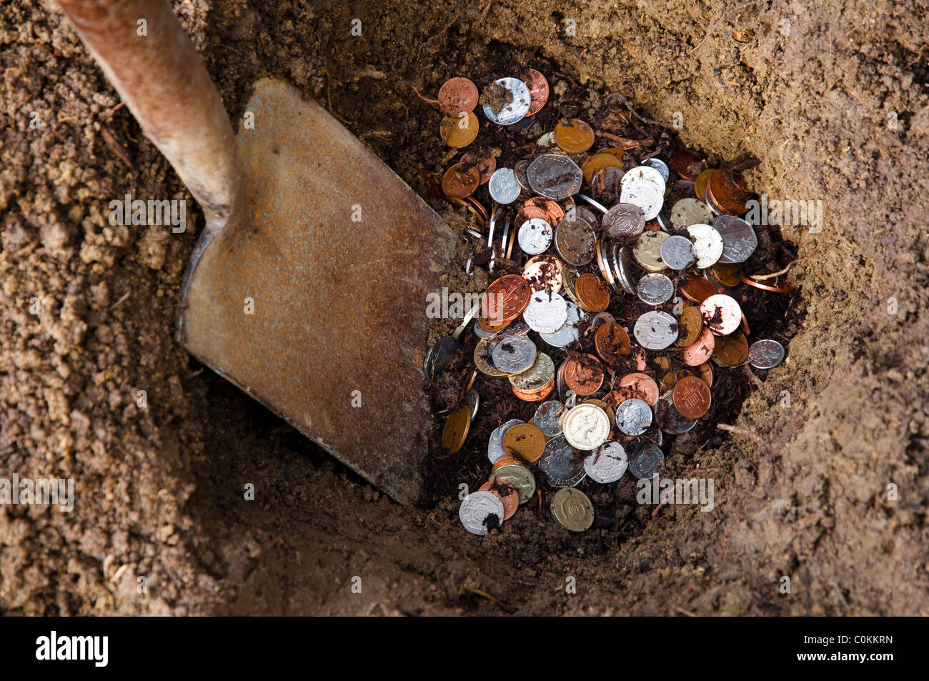 Close-up of Money in a hole. ( A money-pit, safe-keeping for cash, or ...