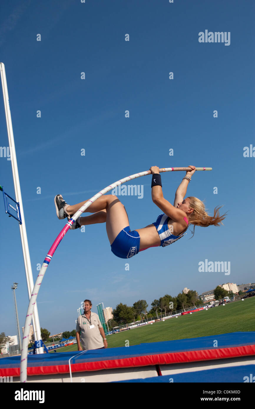 Sport outdoor Athletics competition race track woman athlete jumping ...