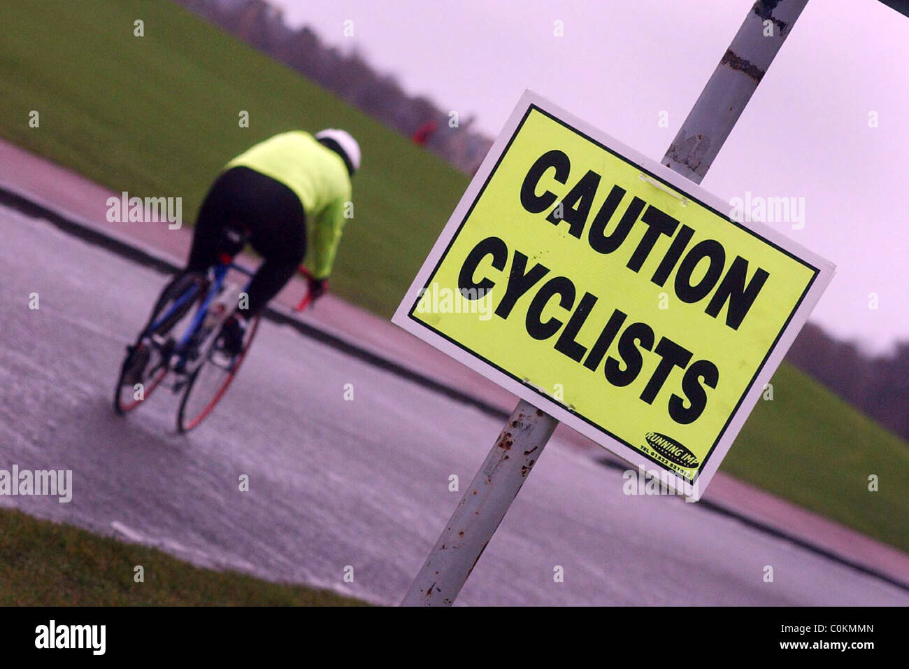 caution cyclist sign with cyclist riding Stock Photo - Alamy