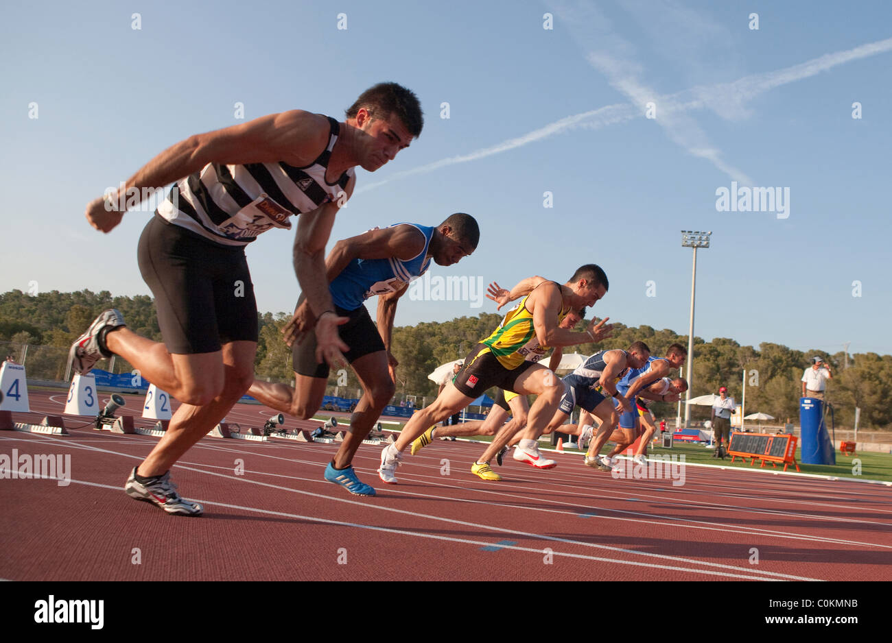 Sport outdoor Athletics competition running race track adult racers ...