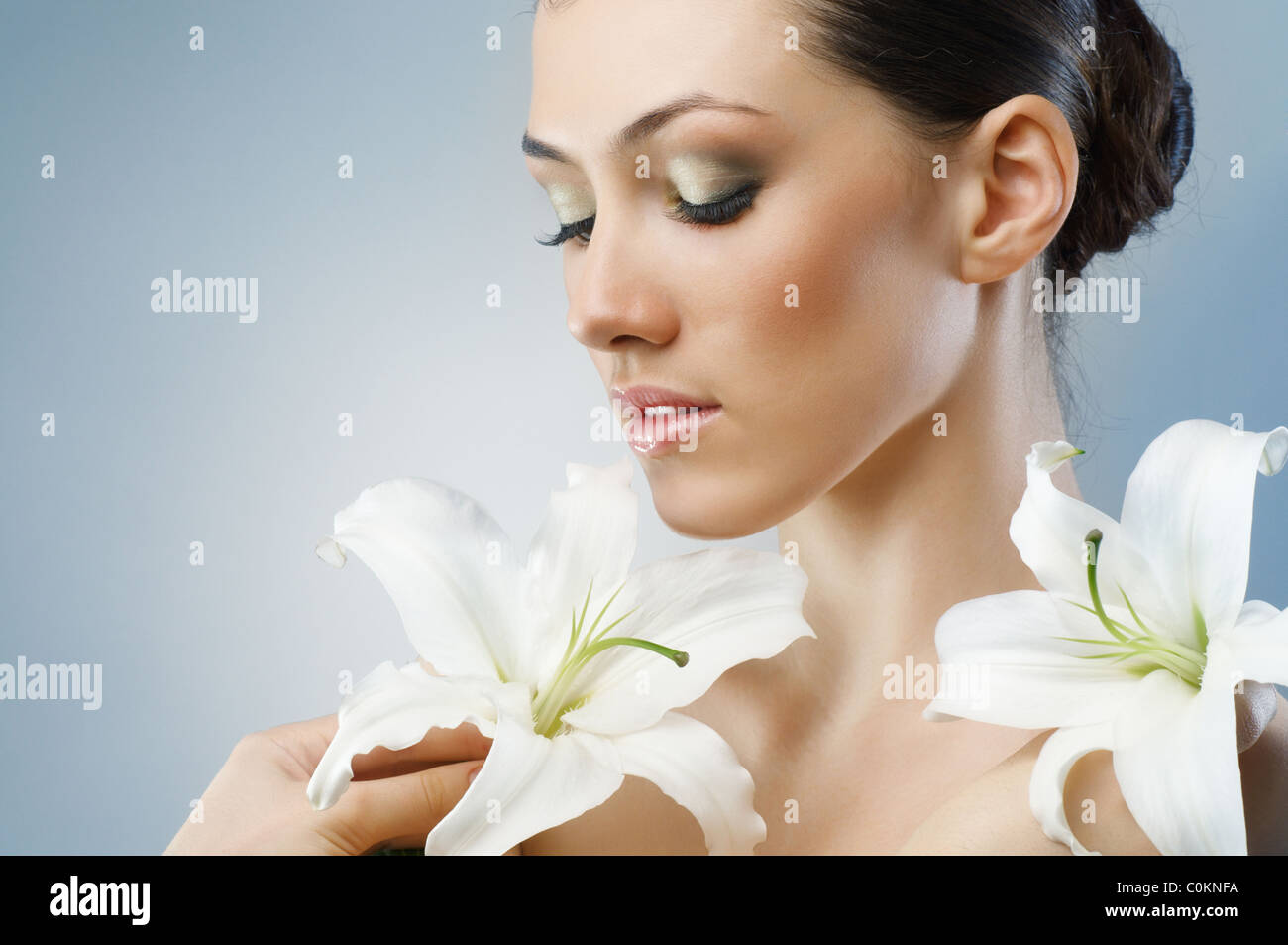 beauty flower girl on the blue background Stock Photo - Alamy