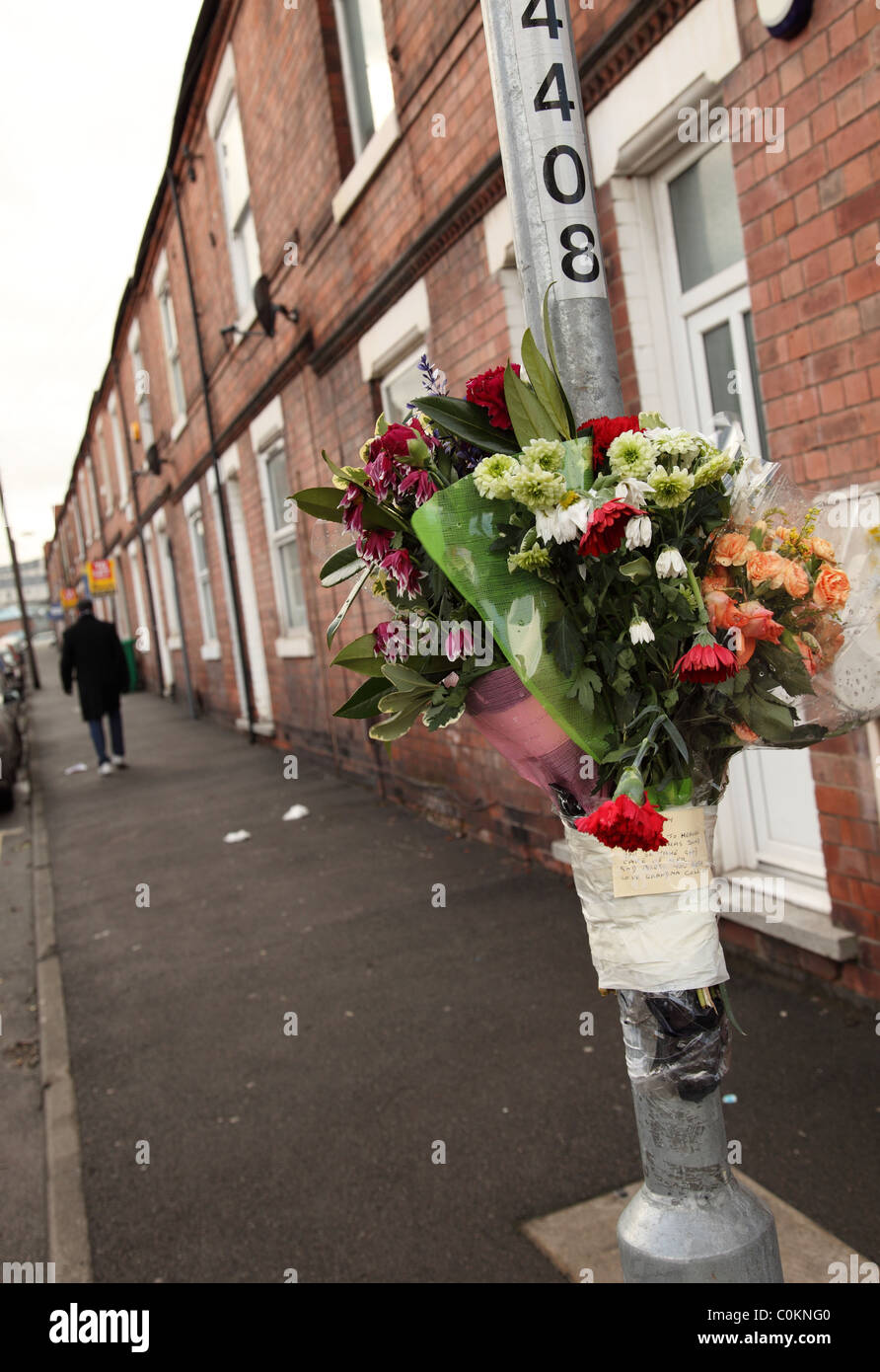 Floral tributes in memory of a gun crime victim murdered in the St Ann ...