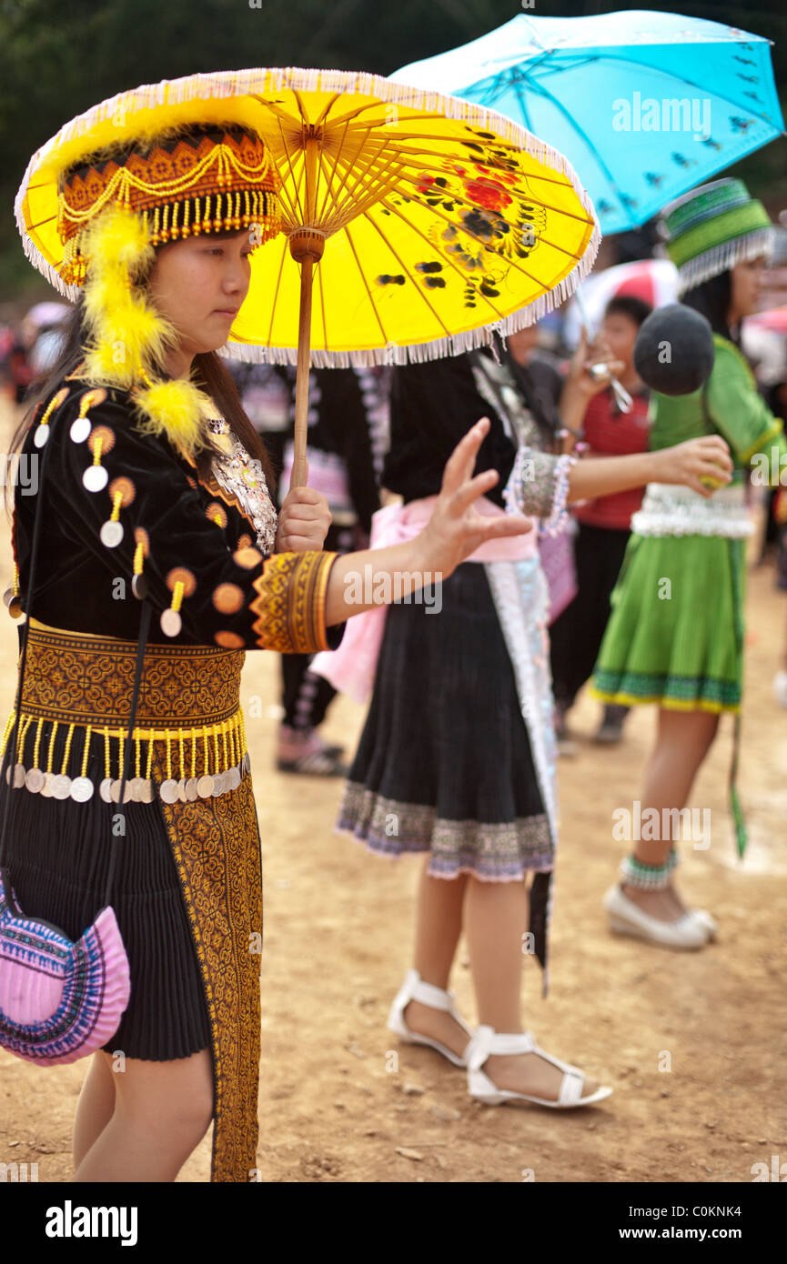 Hmong youth play a traditional courtship game, pov pob, at a new year ...