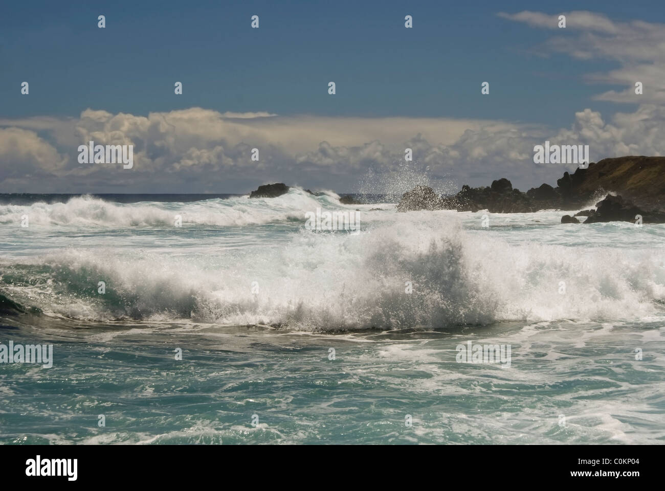 Water breaking against a rugged beach Stock Photo - Alamy