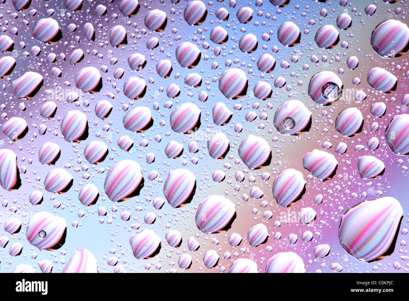 Colorful water drops background Stock Photo - Alamy