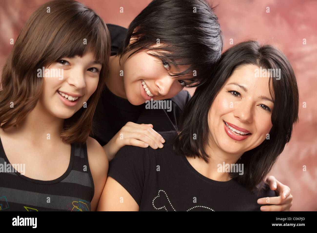 Happy Multiethnic Mother and Her Two Daughters Studio Portrait Stock ...