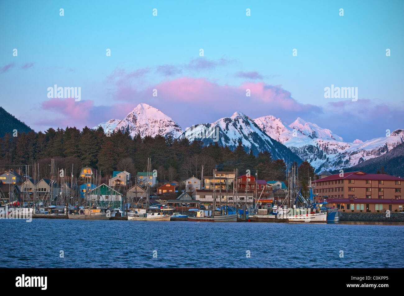 Sunset in Sitka, Alaska harbor and snow capped mountains Stock Photo ...