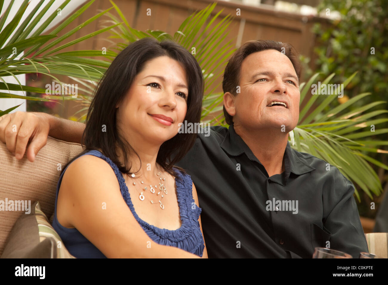 Young Hispanic and Caucasian Couple Socializing Outside Stock Photo - Alamy