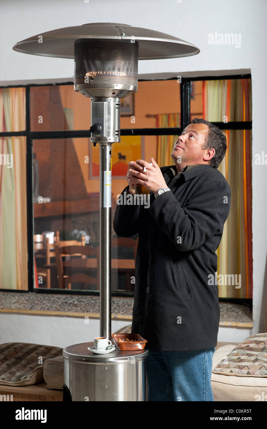 Frustrated smoker forced to smoke outside the pub Stock Photo - Alamy