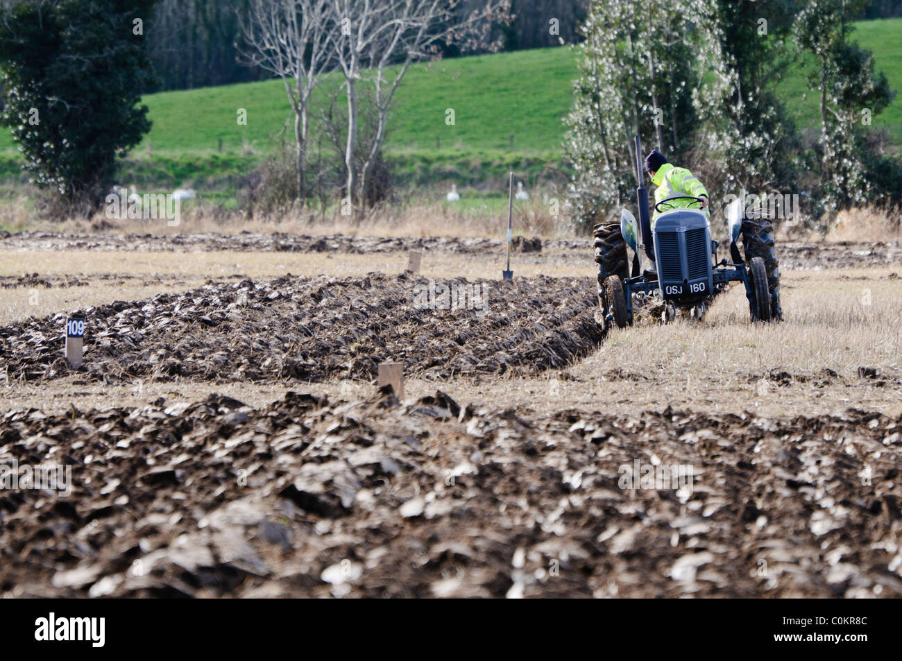 Old fashioned tractor ploughing field hi-res stock photography and ...