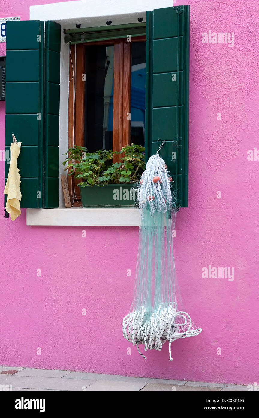 a fish net out of the window in Burano Stock Photo - Alamy