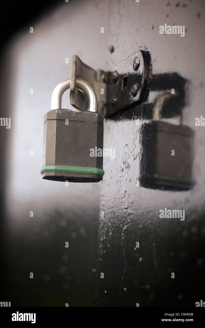 Padlock on steel door Stock Photo - Alamy