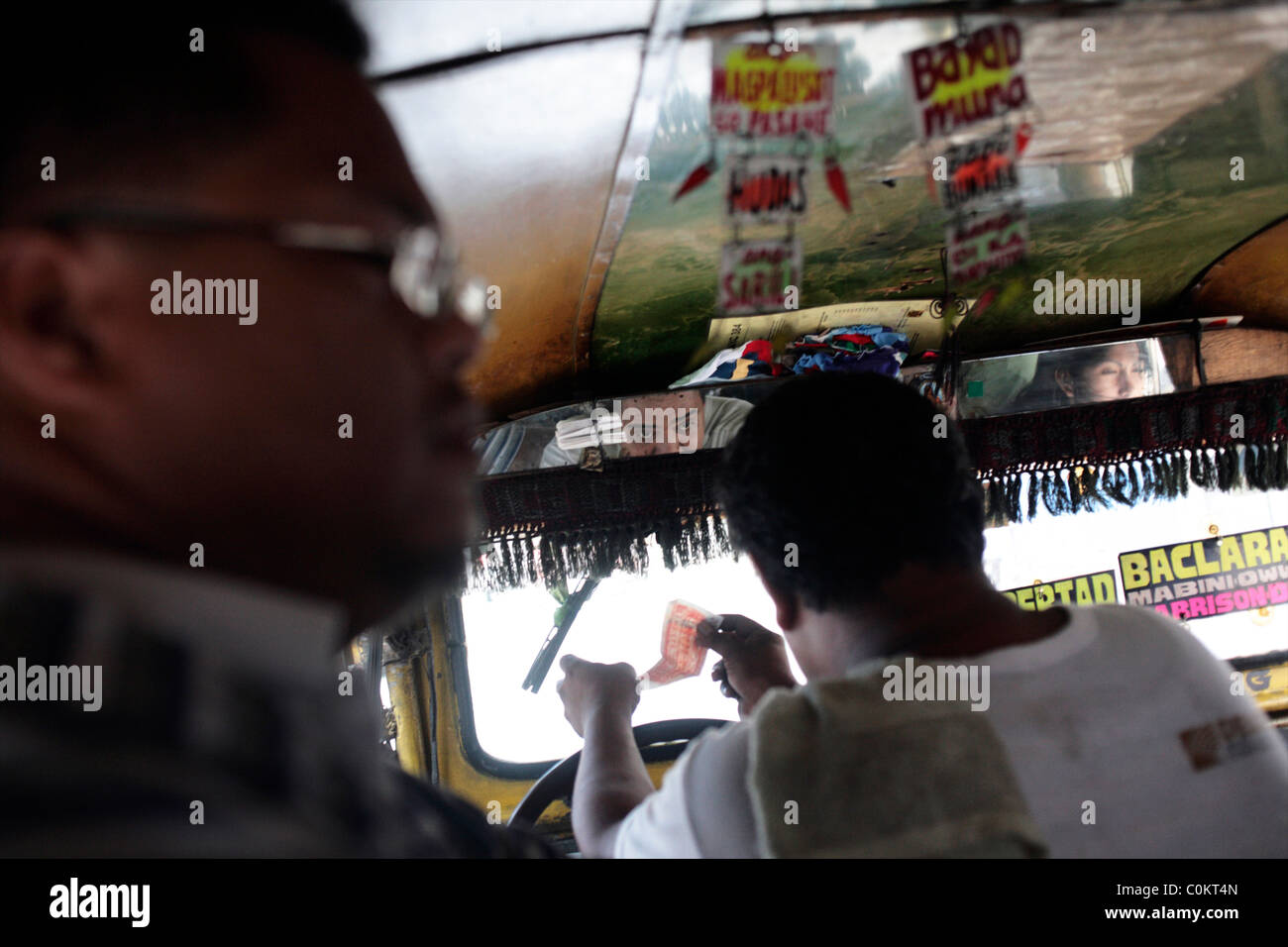 A street view in a Jeepney. Jeepneys are the most popular means of ...