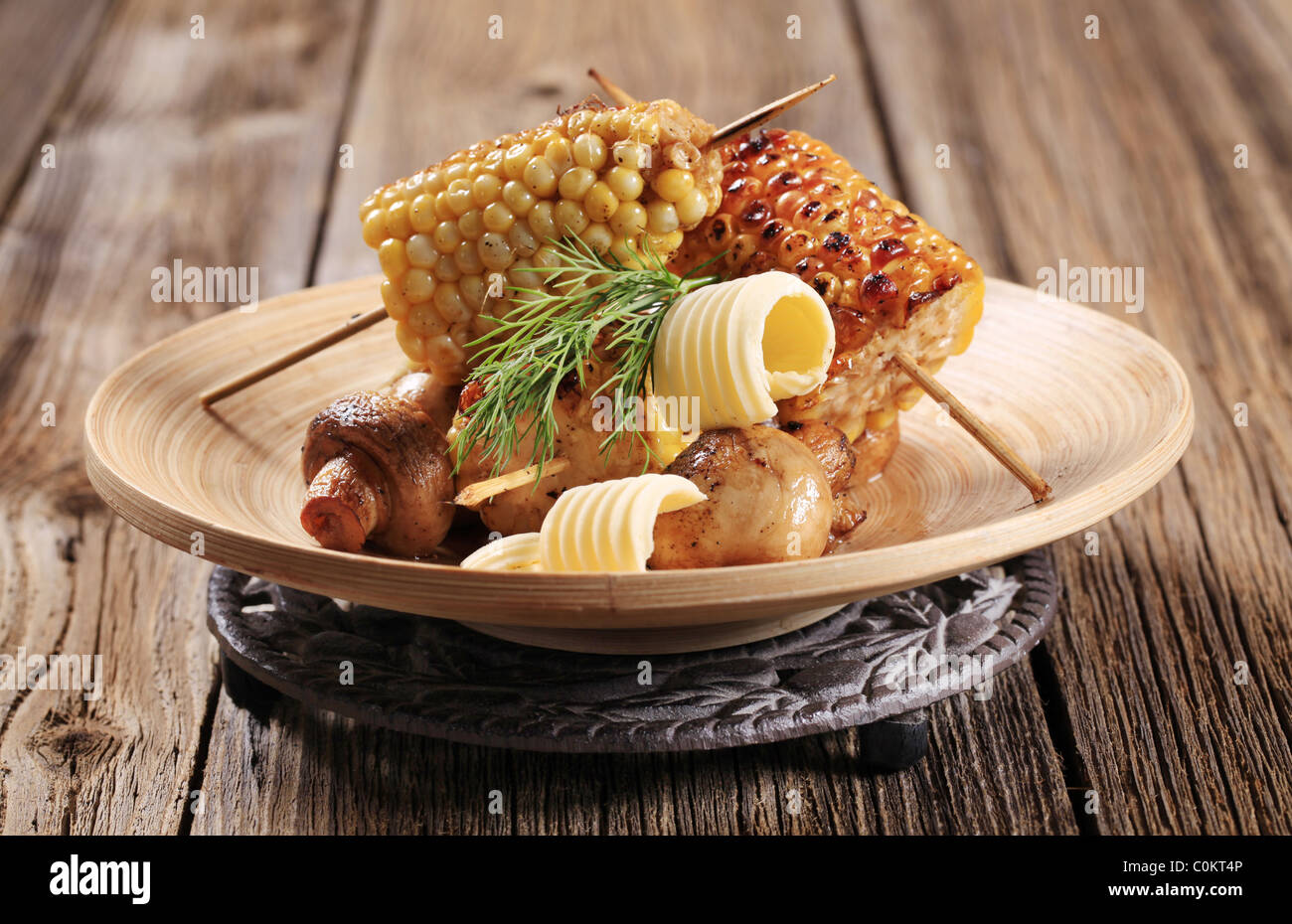 Roasted sweet corn cobs and button mushrooms Stock Photo - Alamy
