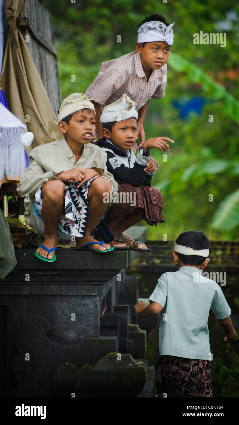 Balinese children gather to celebrate the day of the full moon at the ...