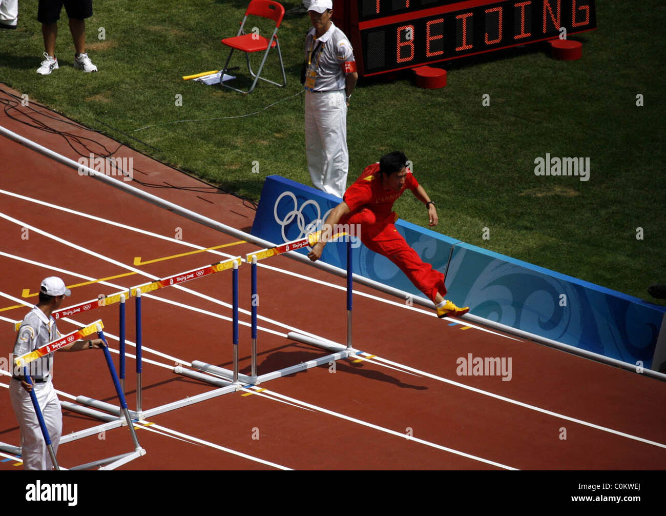 Liu Xiang warms up before the race Liu Xiang, the defending Olympic ...