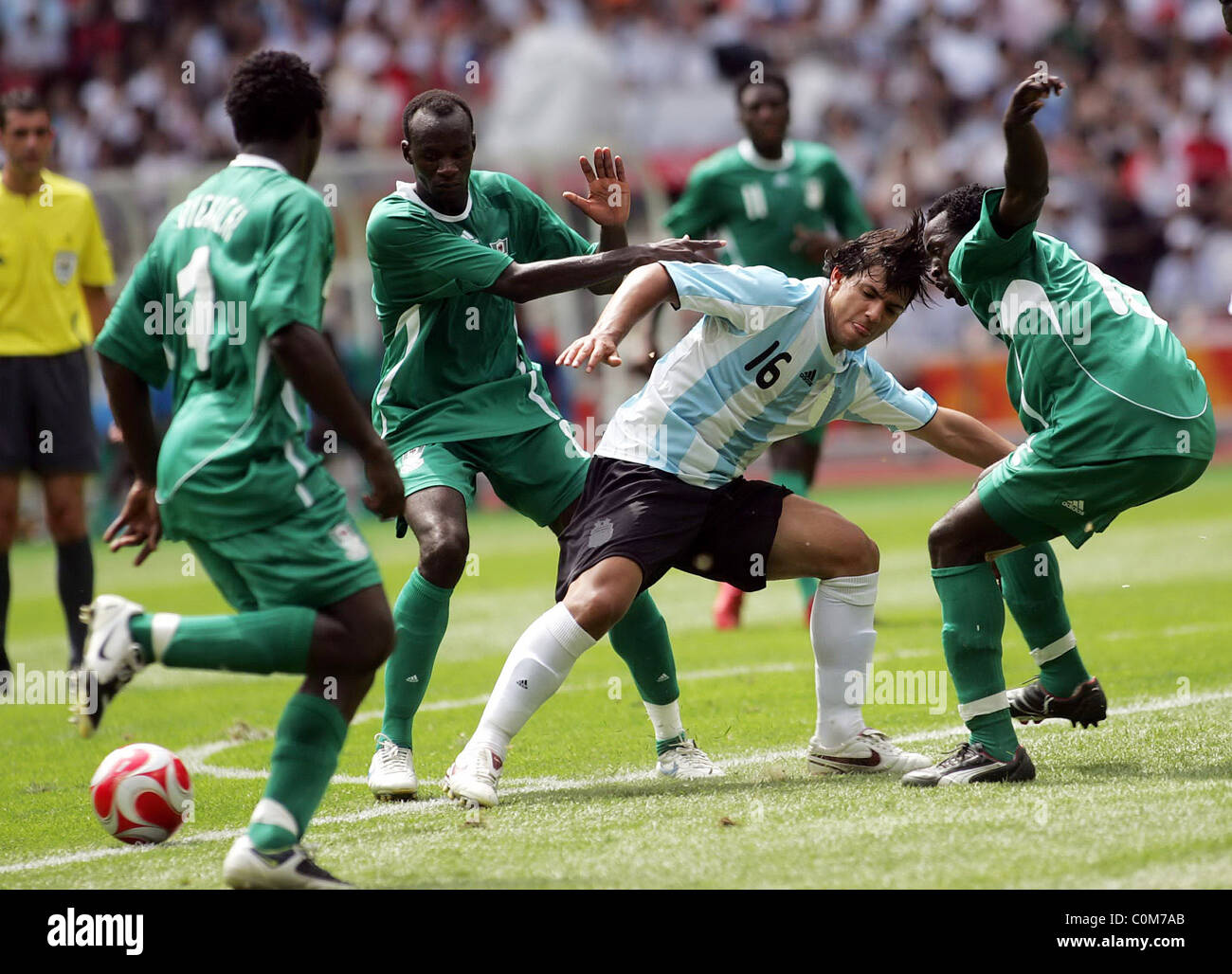 Lionel Messi fights for possession during the match Defending Olympic ...
