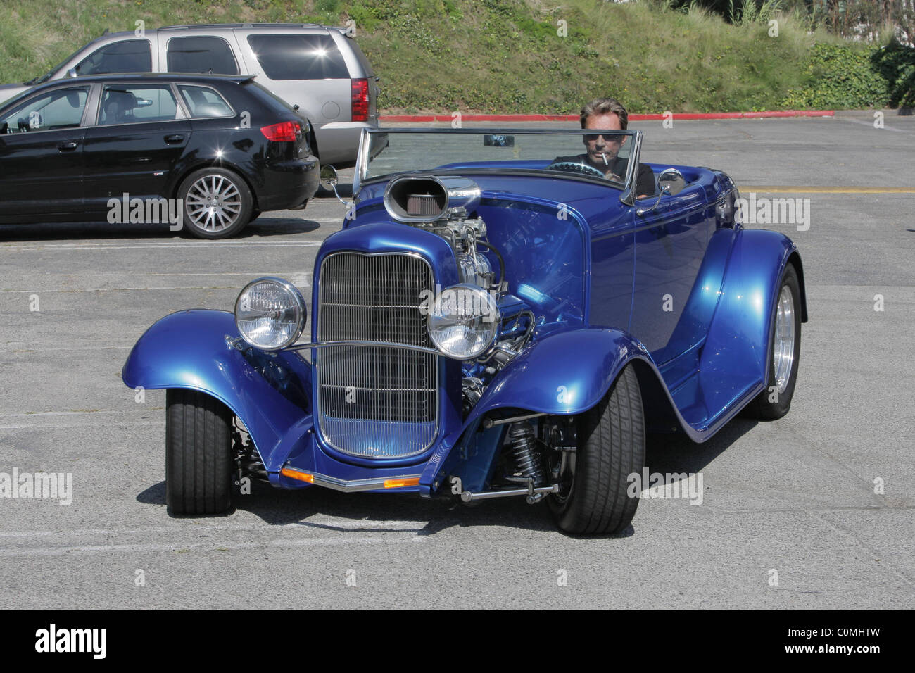 Johnny Hallyday in his hot rod car after lunching at Cafe Med in Sunset ...