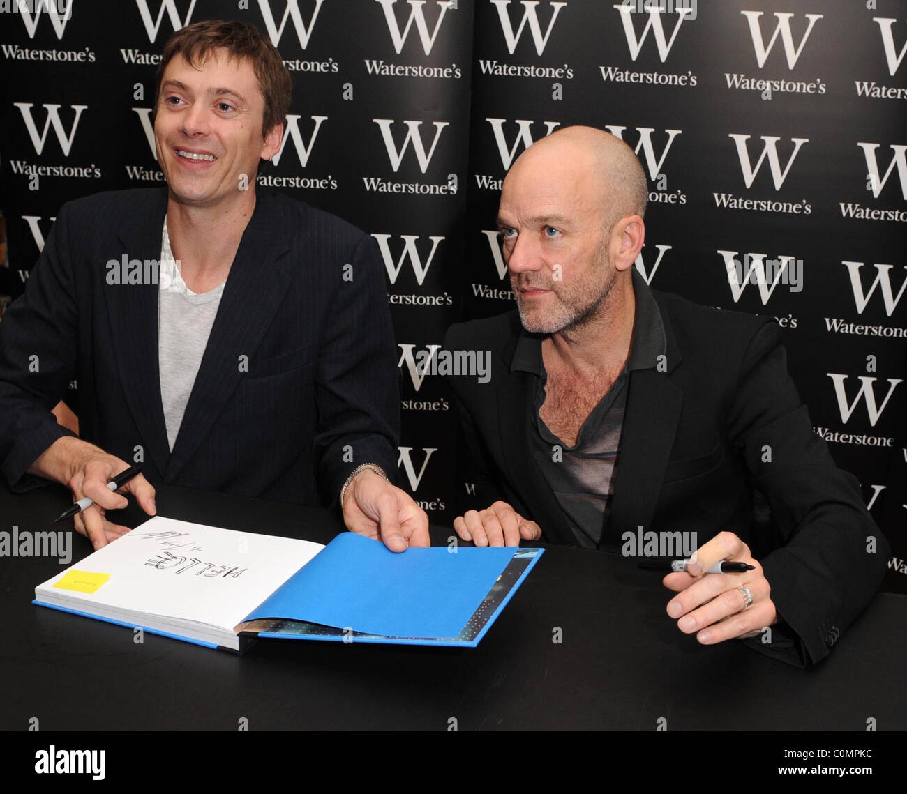 David Belisle and Michael Stipe of R.E.M signing their new book 'Hello ...